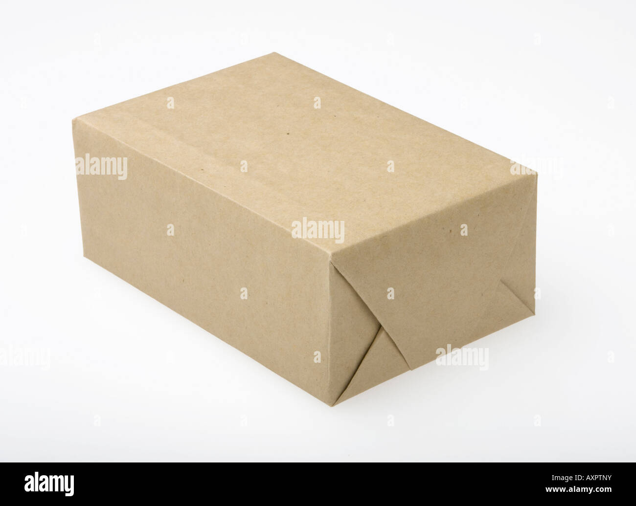 Small parcel wrapped in plain brown paper White background Stock Photo ...