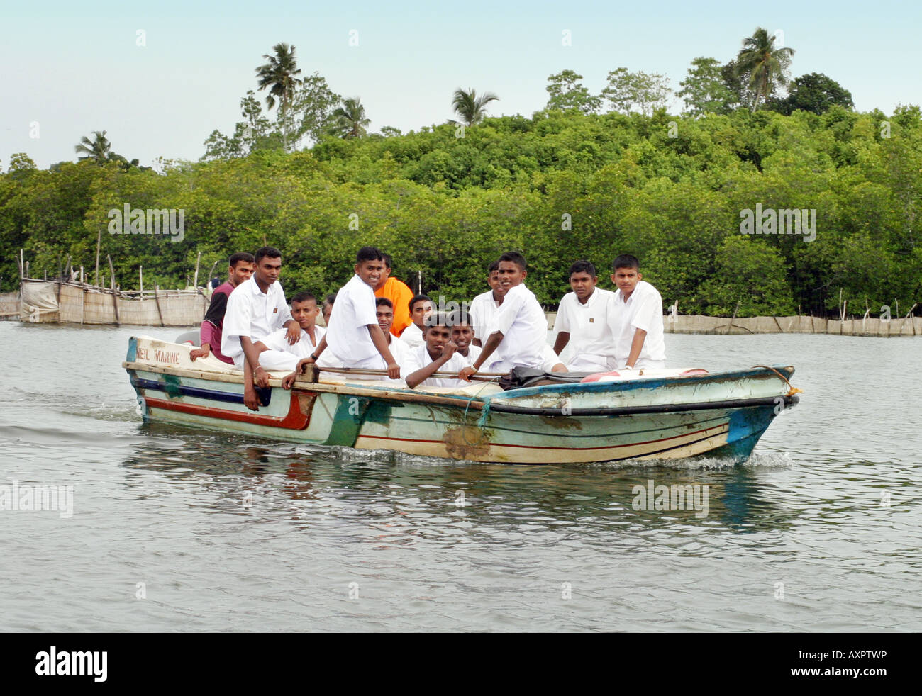 Schoolboys going to school by river boat, Galle, Sri Lanka Stock Photo ...