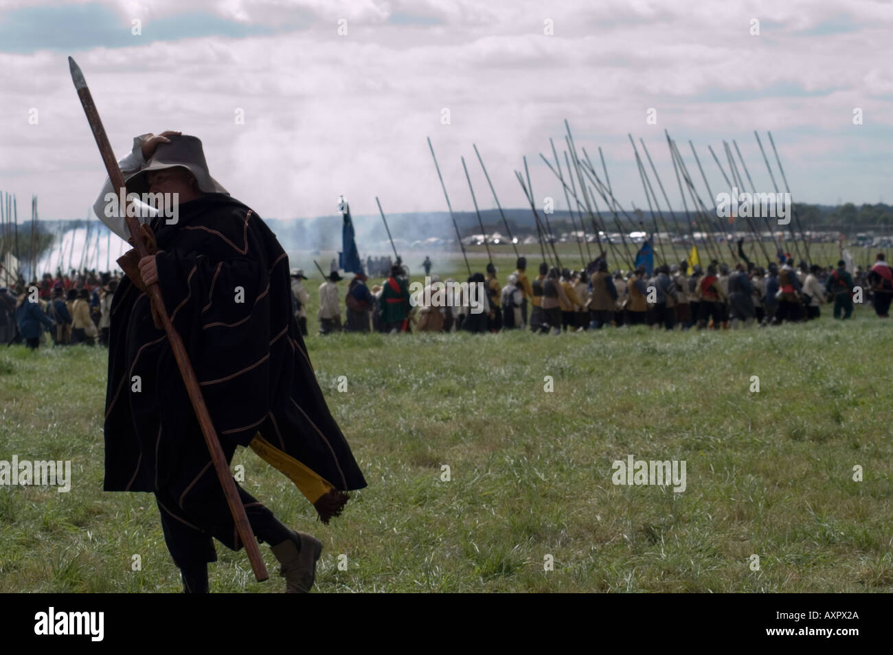 A caped re-enactor stands alone at an English civil war re enactment by ...