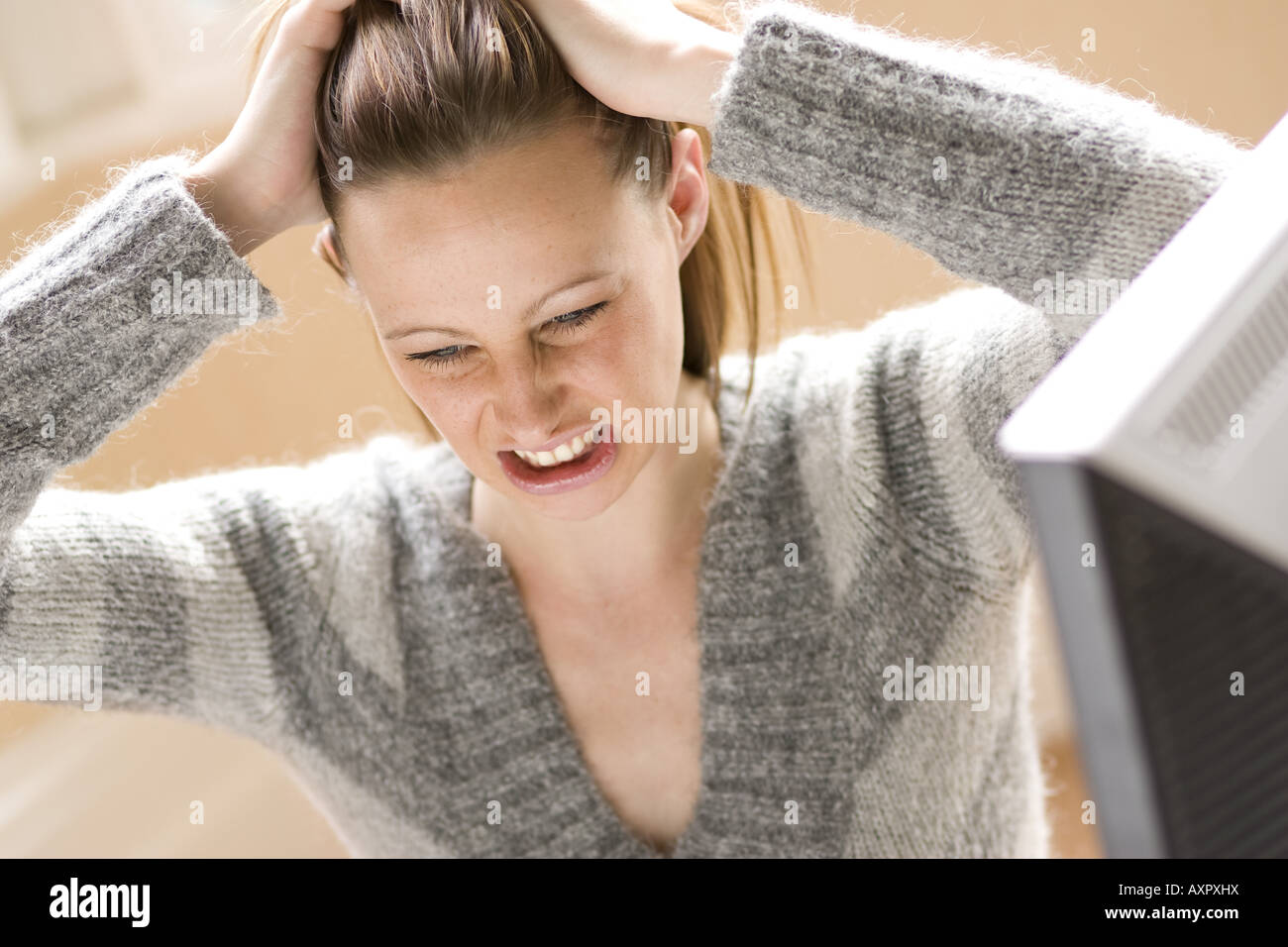 Frustrated woman using computer Stock Photo - Alamy