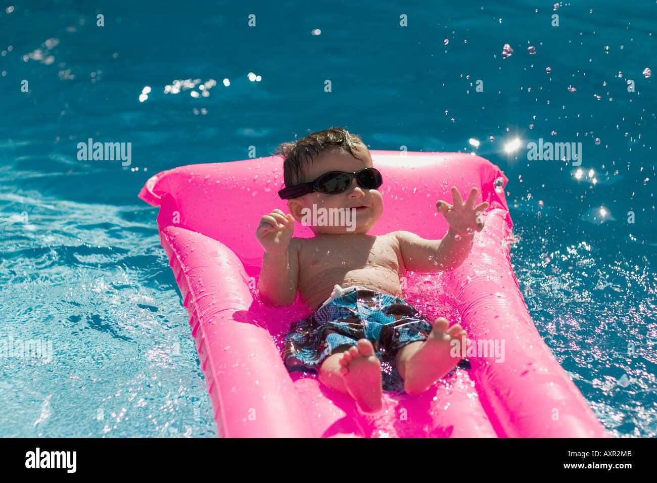 Cool baby in pool Stock Photo - Alamy