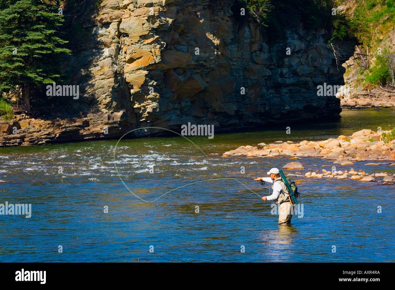 Fly fishing in a river Stock Photo - Alamy