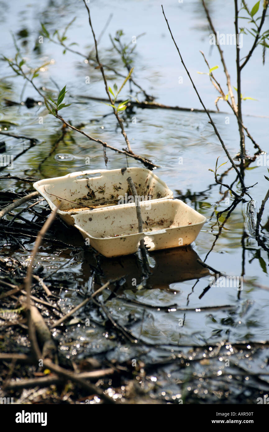 Fast food Carton floating in water Stock Photo - Alamy