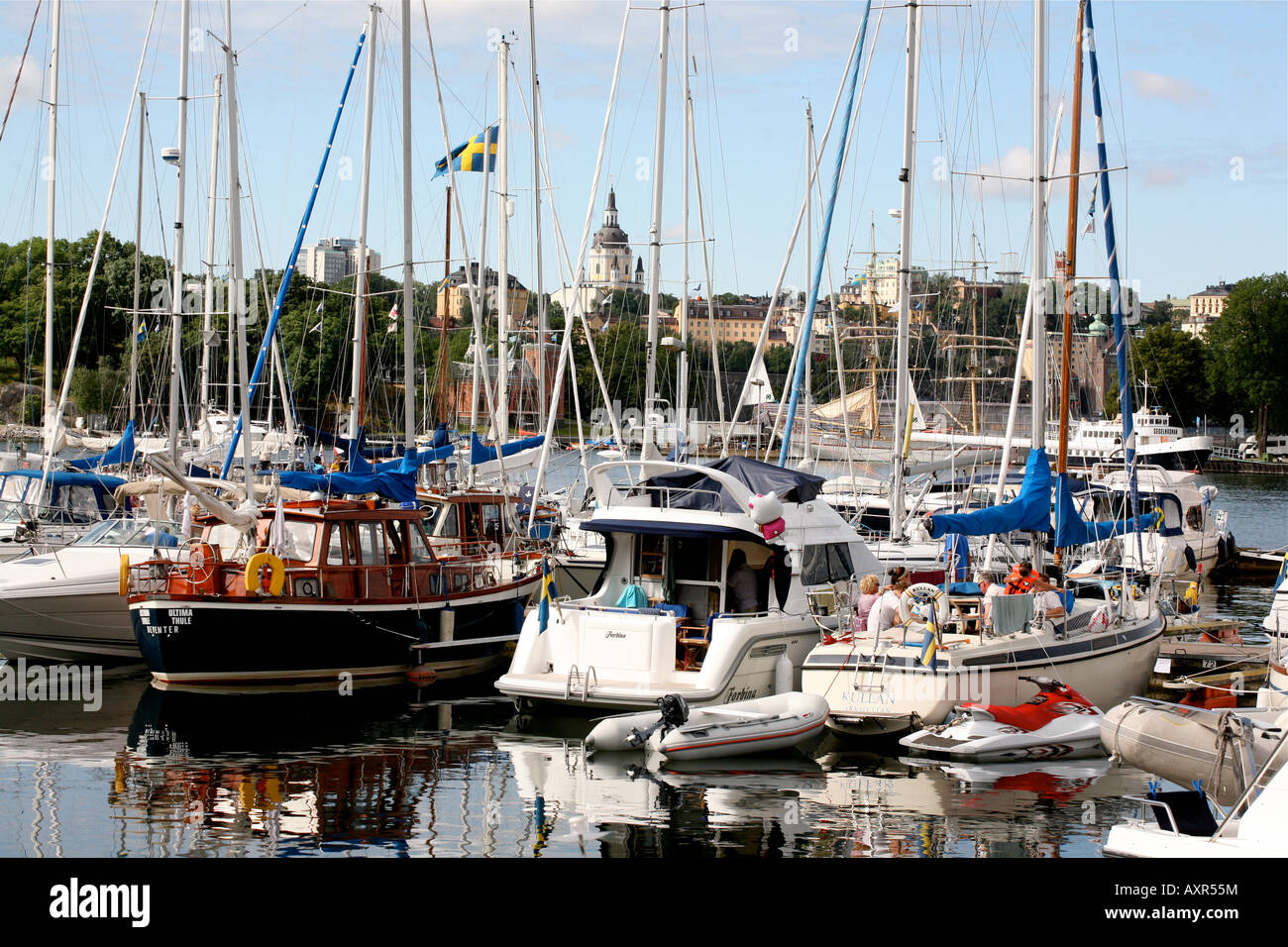 pleasure craft marina dock with colorful boats Stock Photo - Alamy