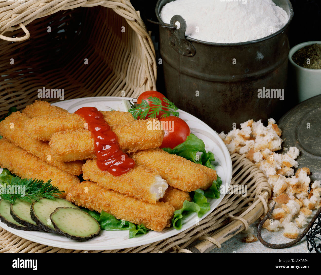Fried fish sticks with sauce in a plate Stock Photo - Alamy