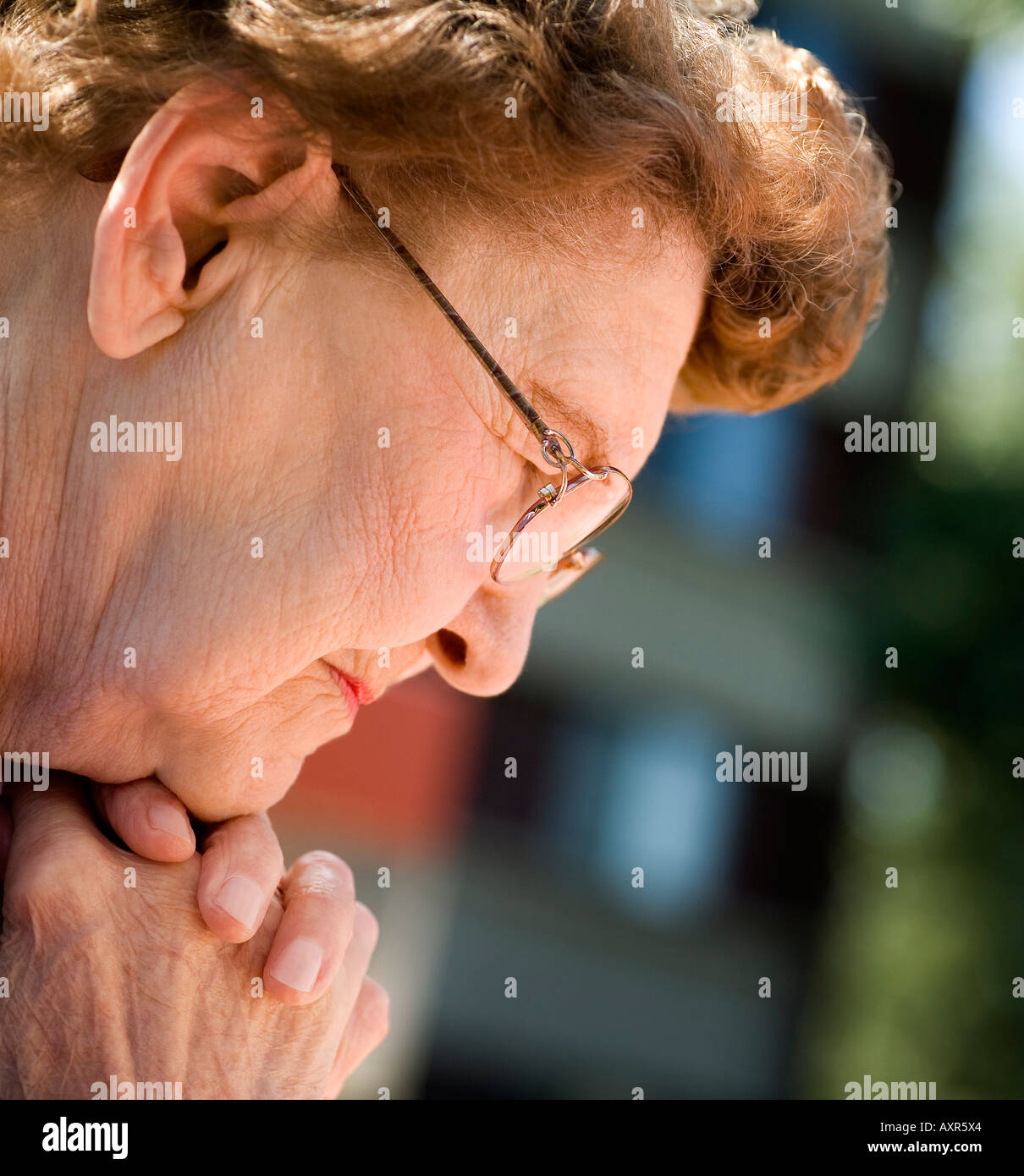 Old woman praying belief hi-res stock photography and images - Alamy