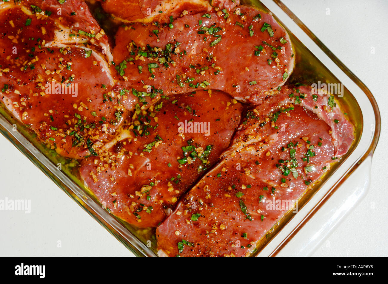 Marinating rib eye steaks Stock Photo - Alamy