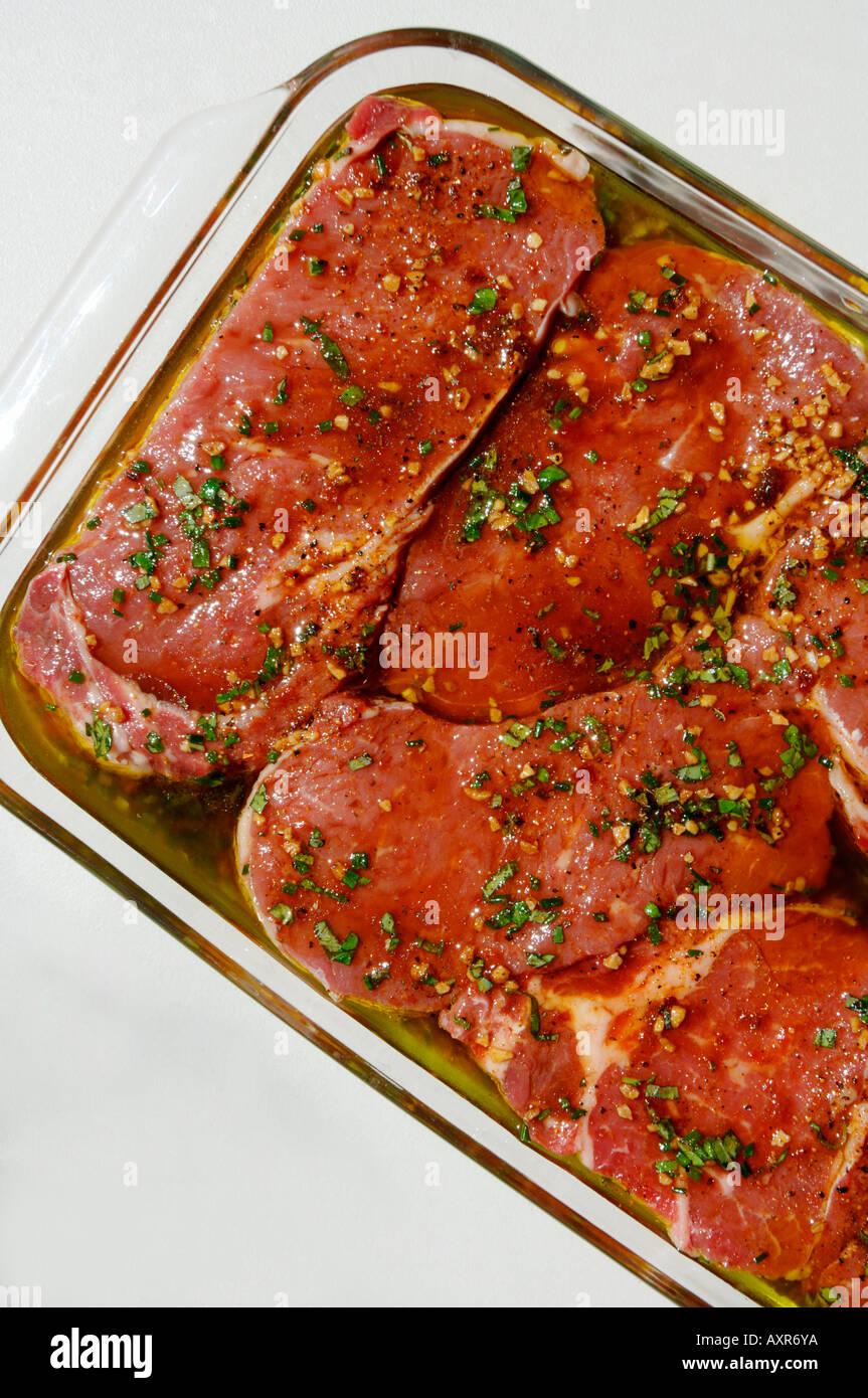 Marinating rib eye steaks Stock Photo - Alamy