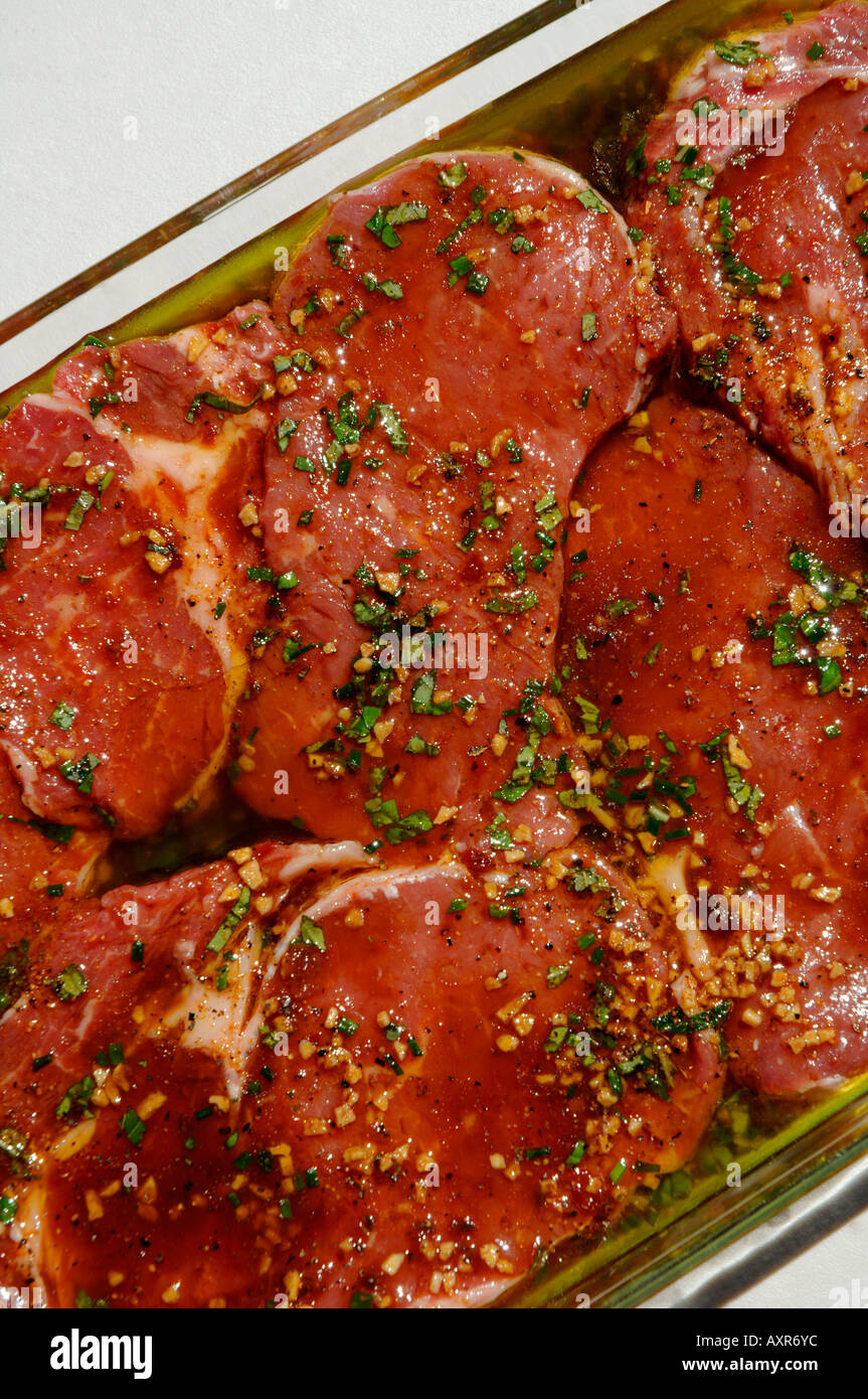Marinating rib eye steaks Stock Photo - Alamy