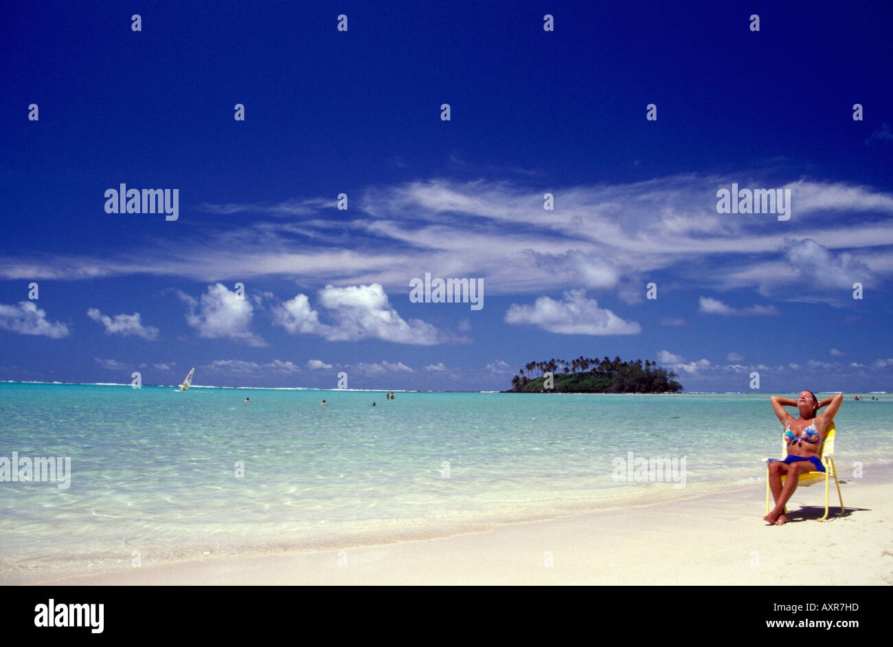 Woman sunbathing on oceanside hi-res stock photography and images - Alamy