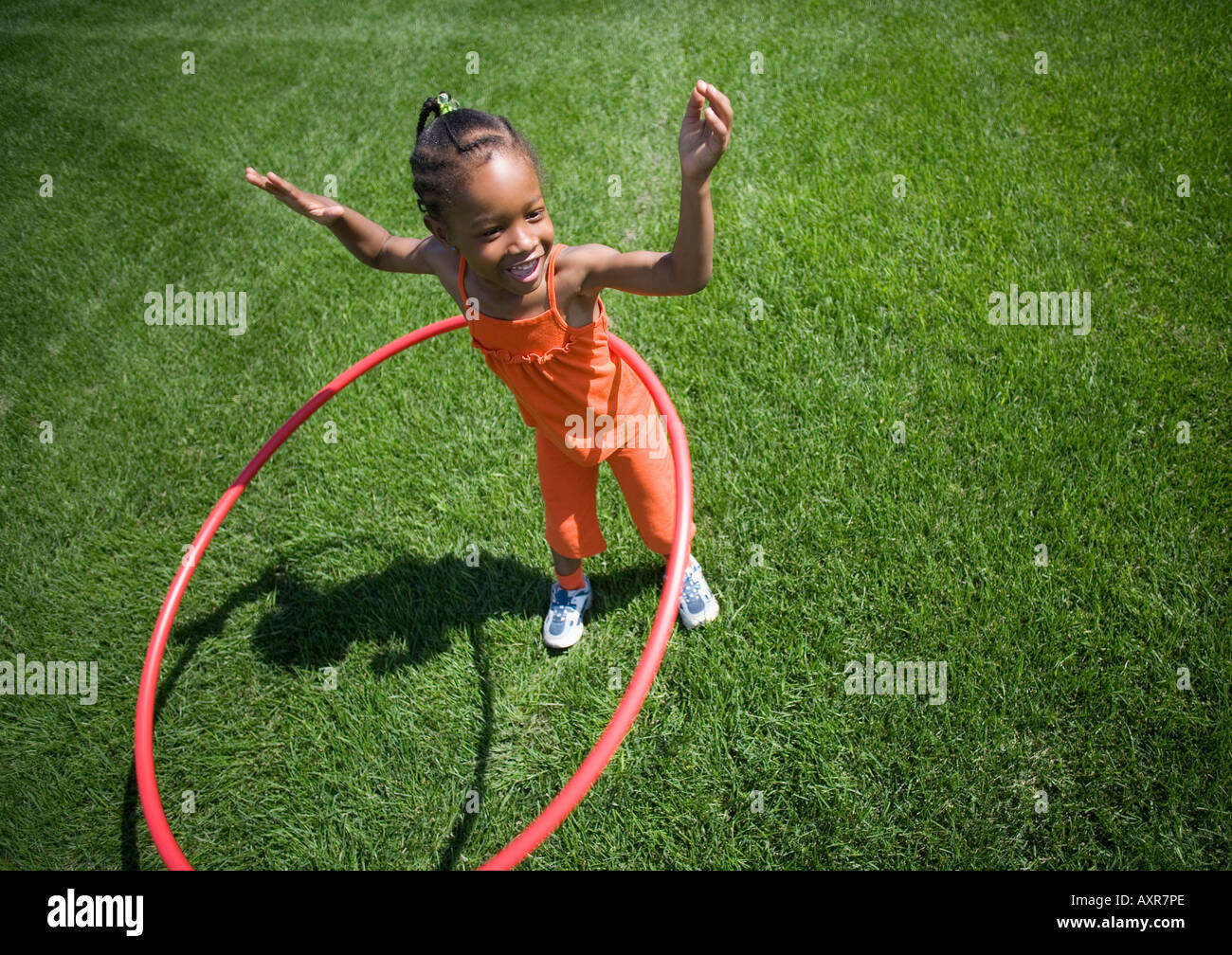 Happy kid hula hoop african american hi-res stock photography and ...