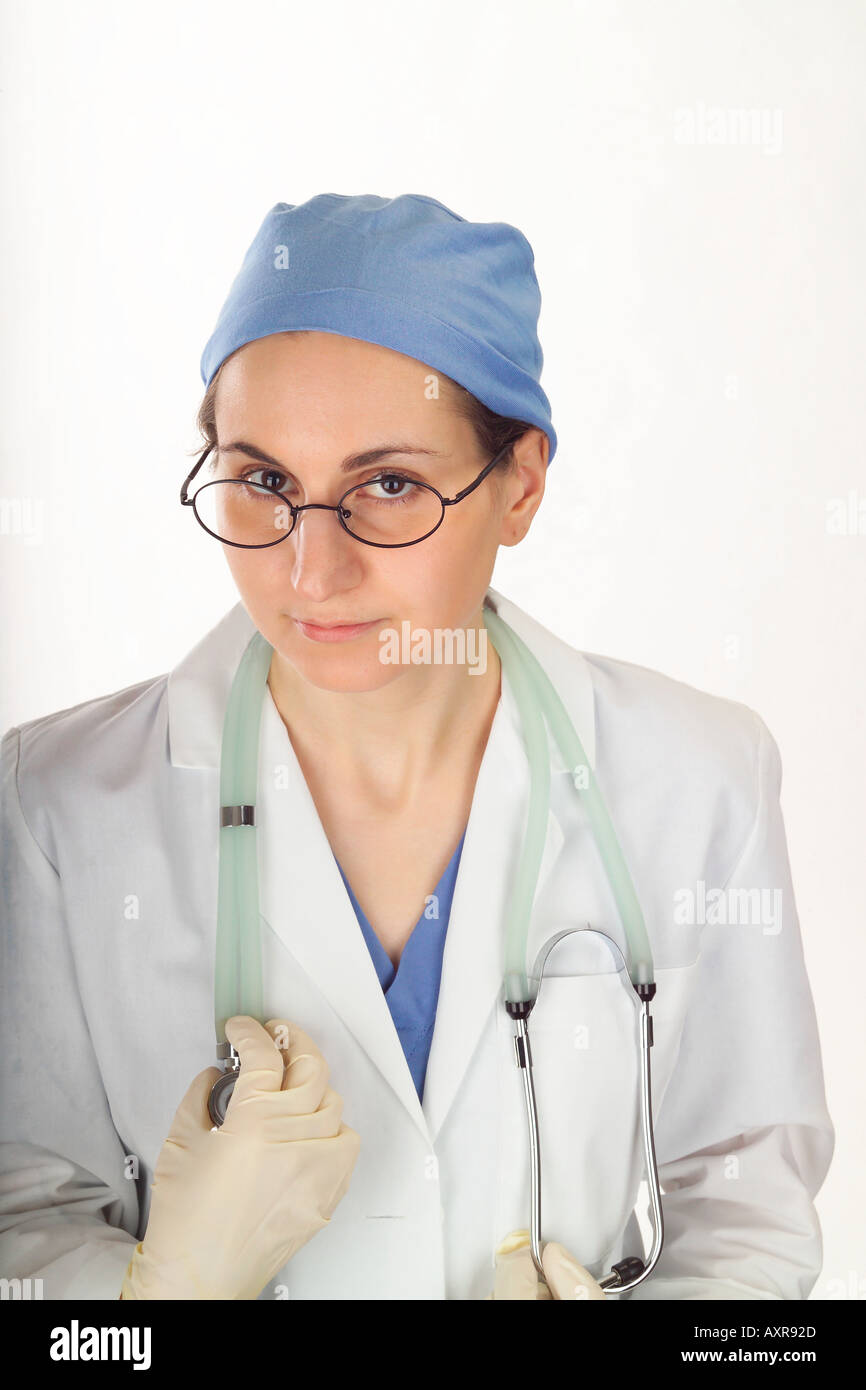 Female doctor or nurse is wearing scrubs cap white lab coat and glasses ...