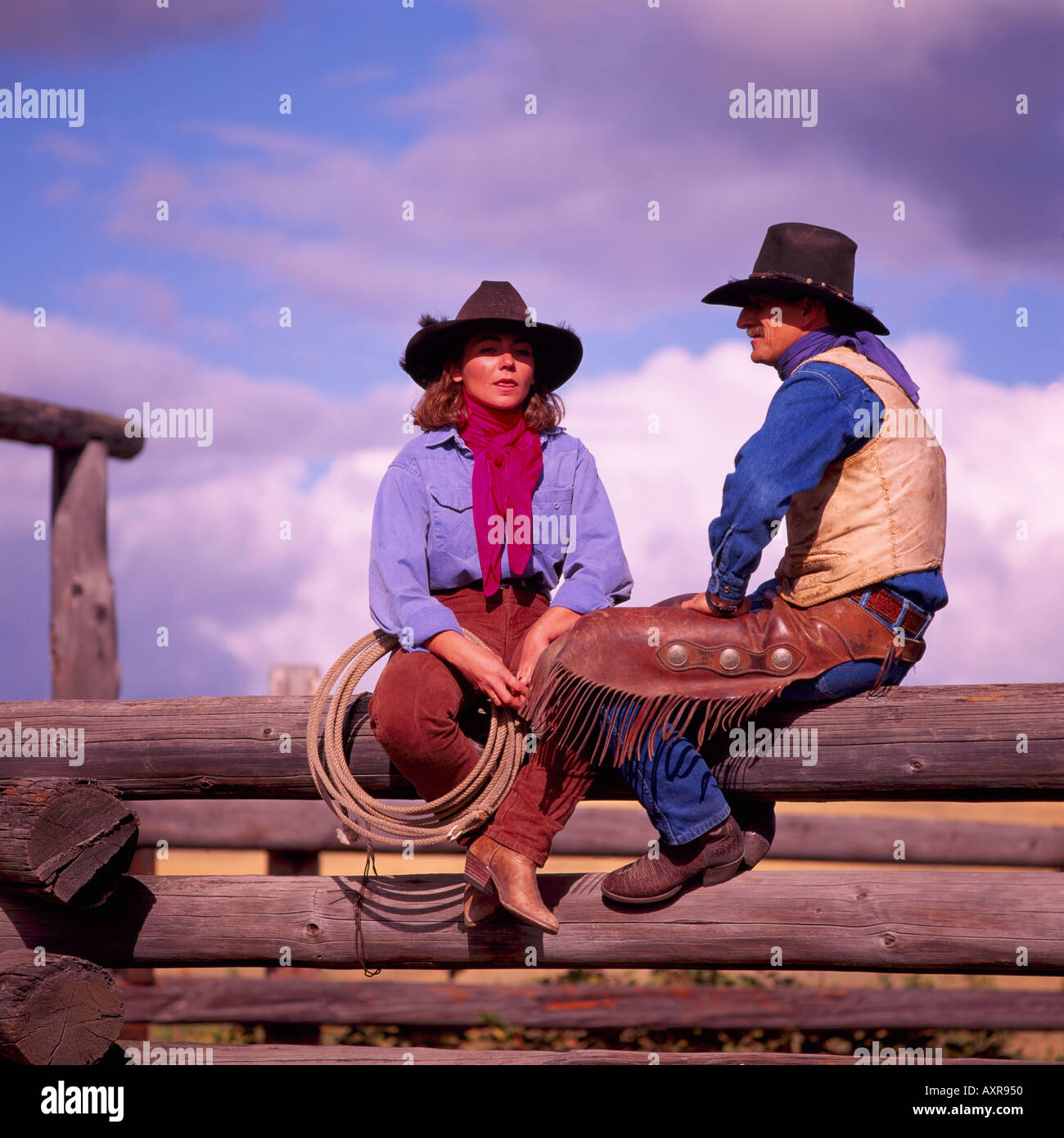 Cowboy sitting on fence hi-res stock photography and images - Alamy