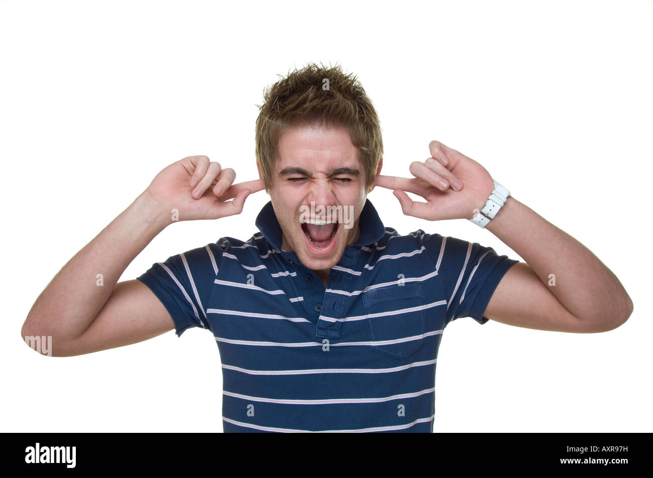 man with fingers in ears shouting Stock Photo - Alamy