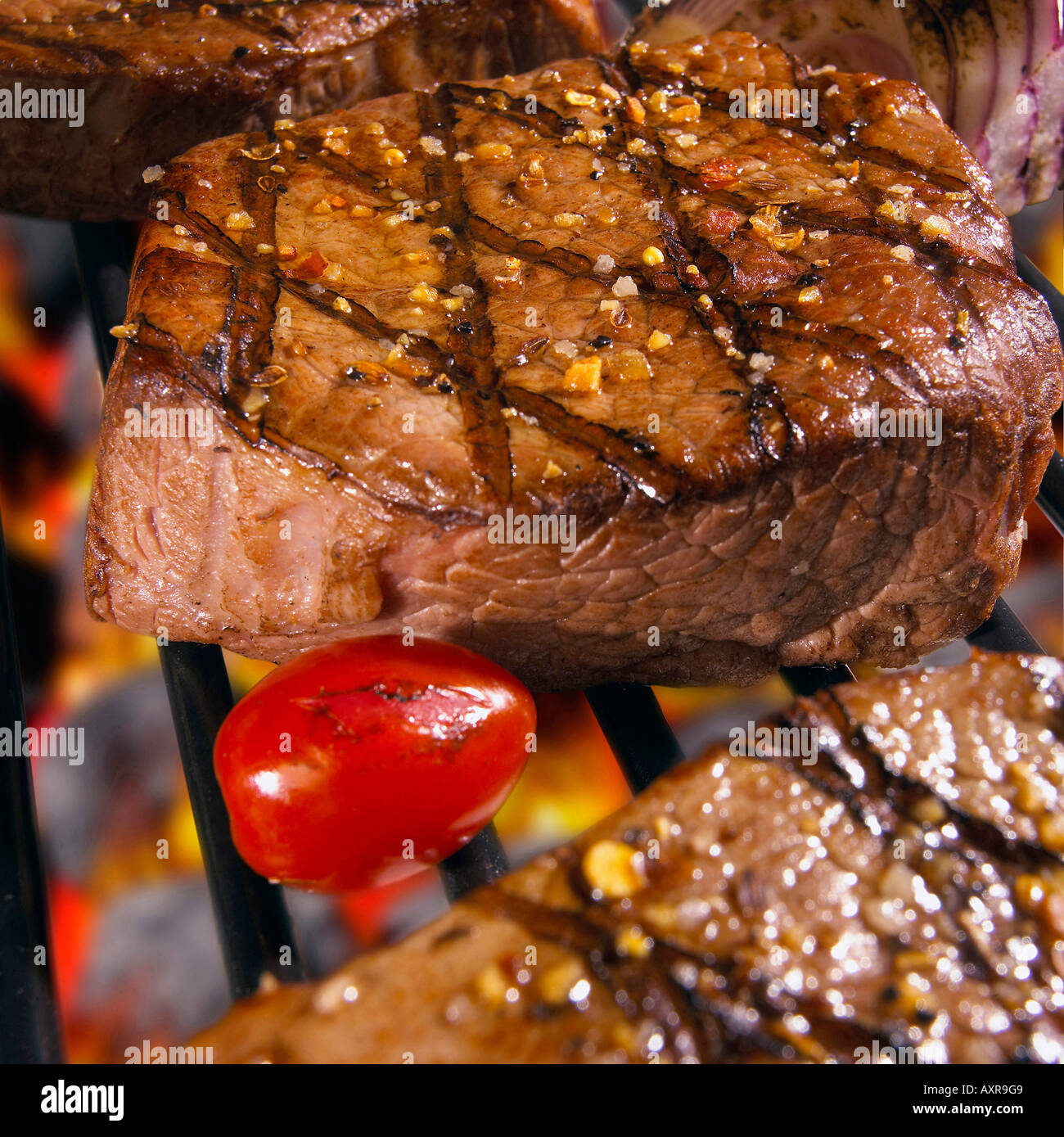 Close-up of steaks cooked over a barbecue grill Stock Photo - Alamy