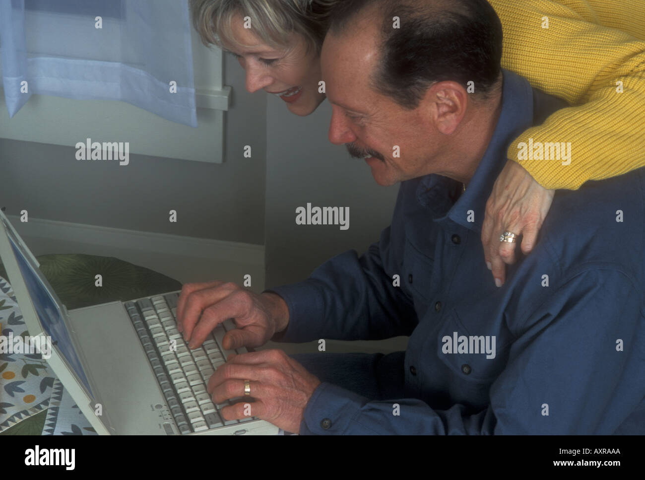 Excited Couple on Computer Stock Photo - Alamy