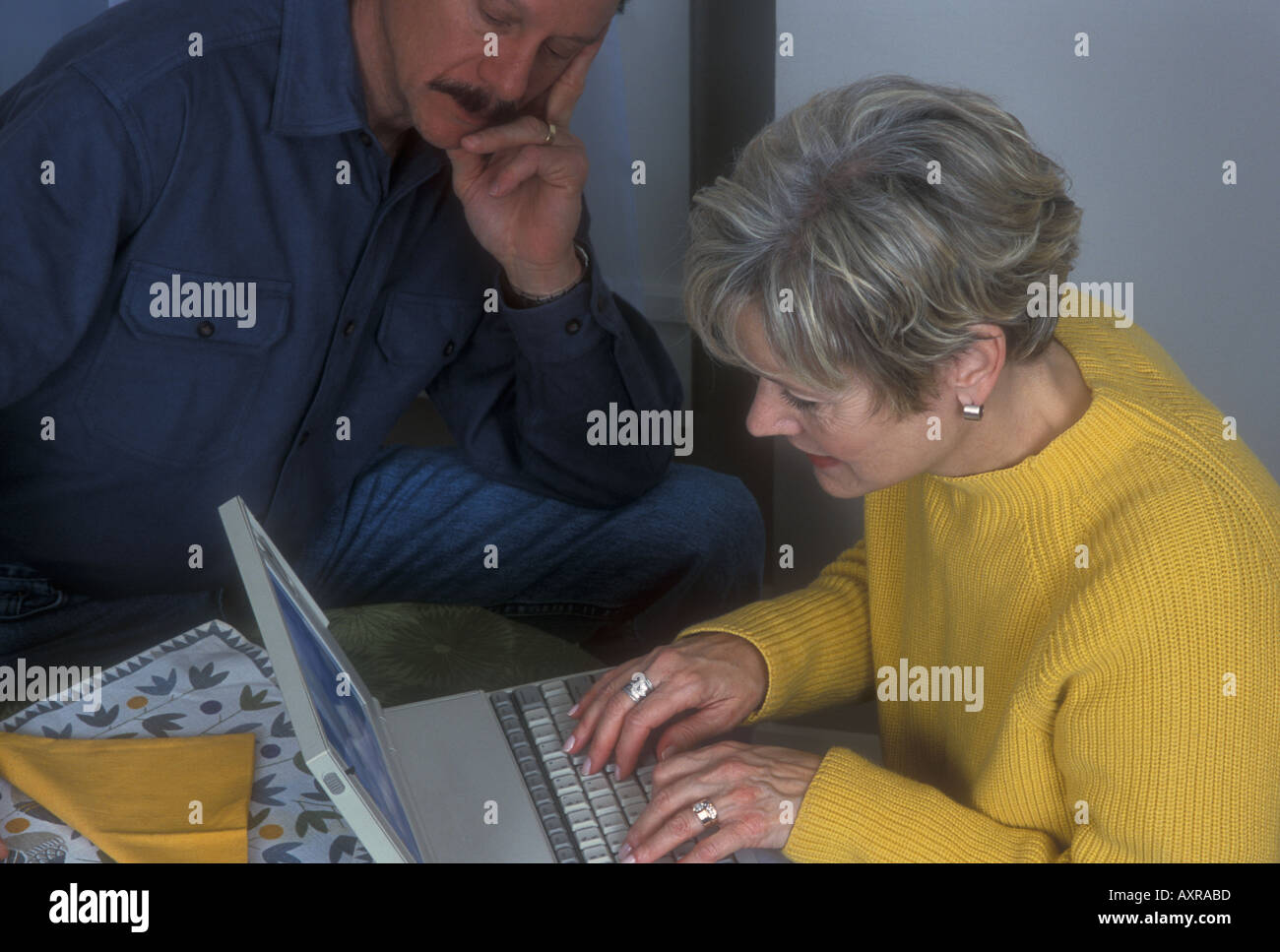 Man Watching Woman Working on Computer Stock Photo - Alamy