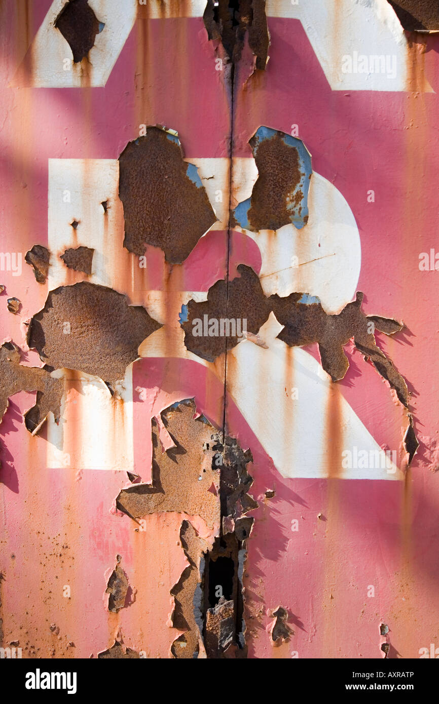 Peeling letter R on rusting disused scrap yard gates. Use for drop caps ...