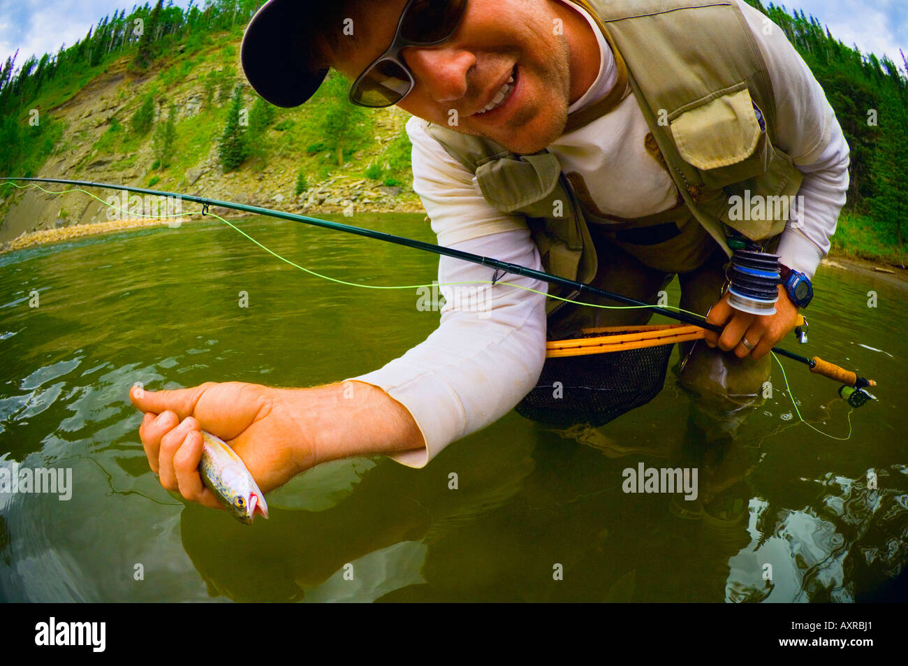 Fly fishing in an Alberta river Stock Photo - Alamy