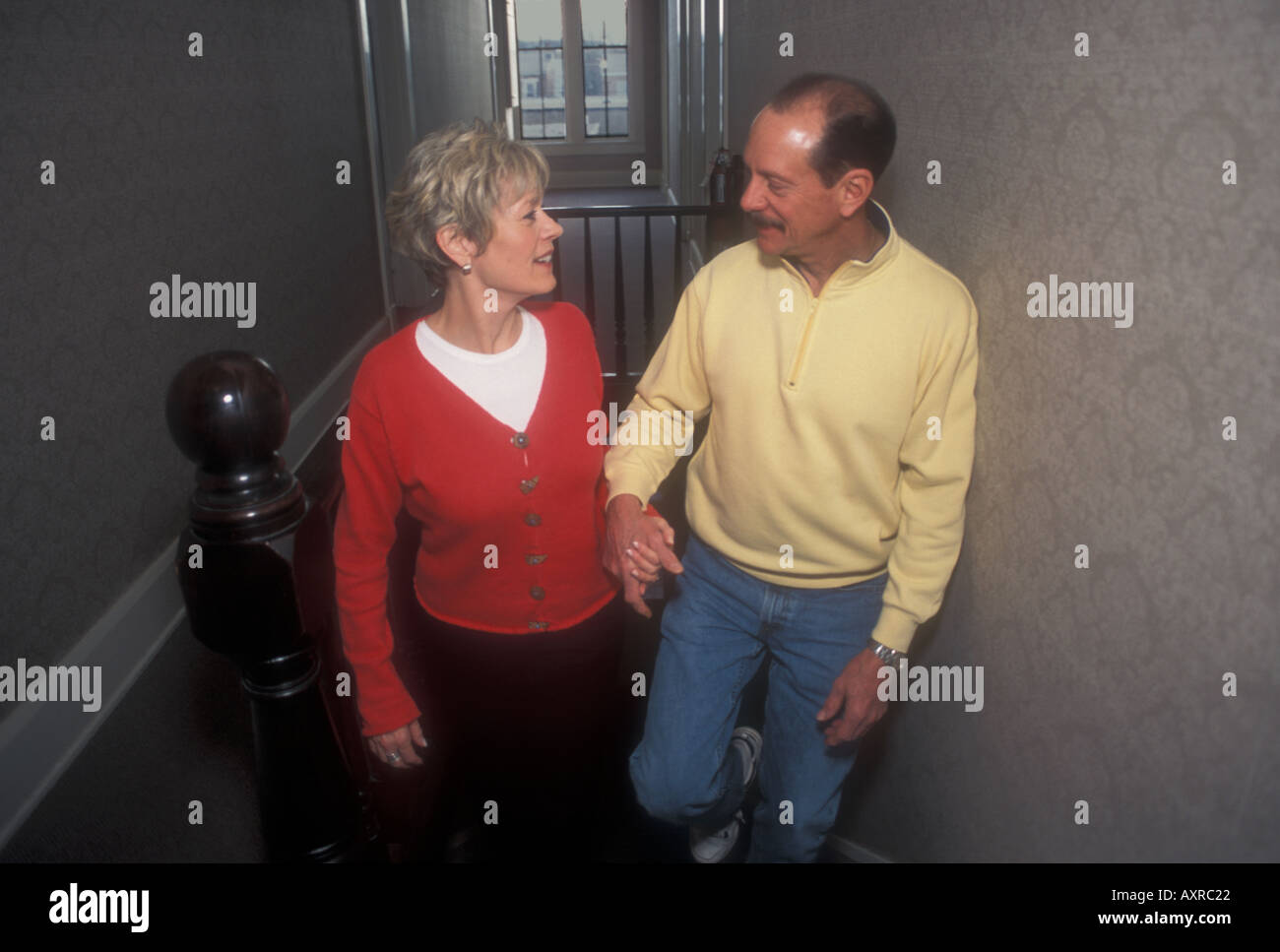 Holding hands walking up stairs hi-res stock photography and images - Alamy