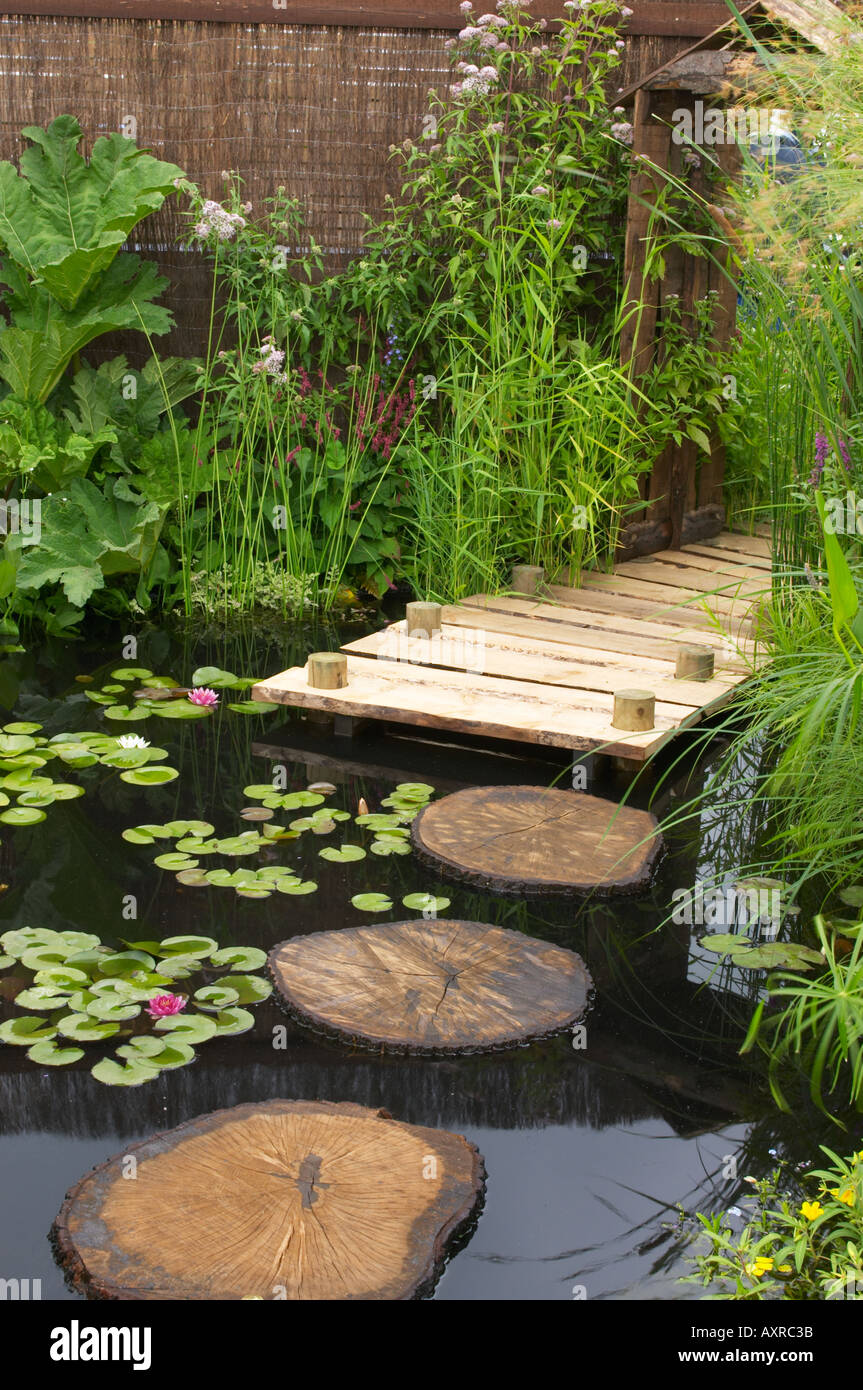 wooden decking leading out to steps across pool in garden Flower Show ...