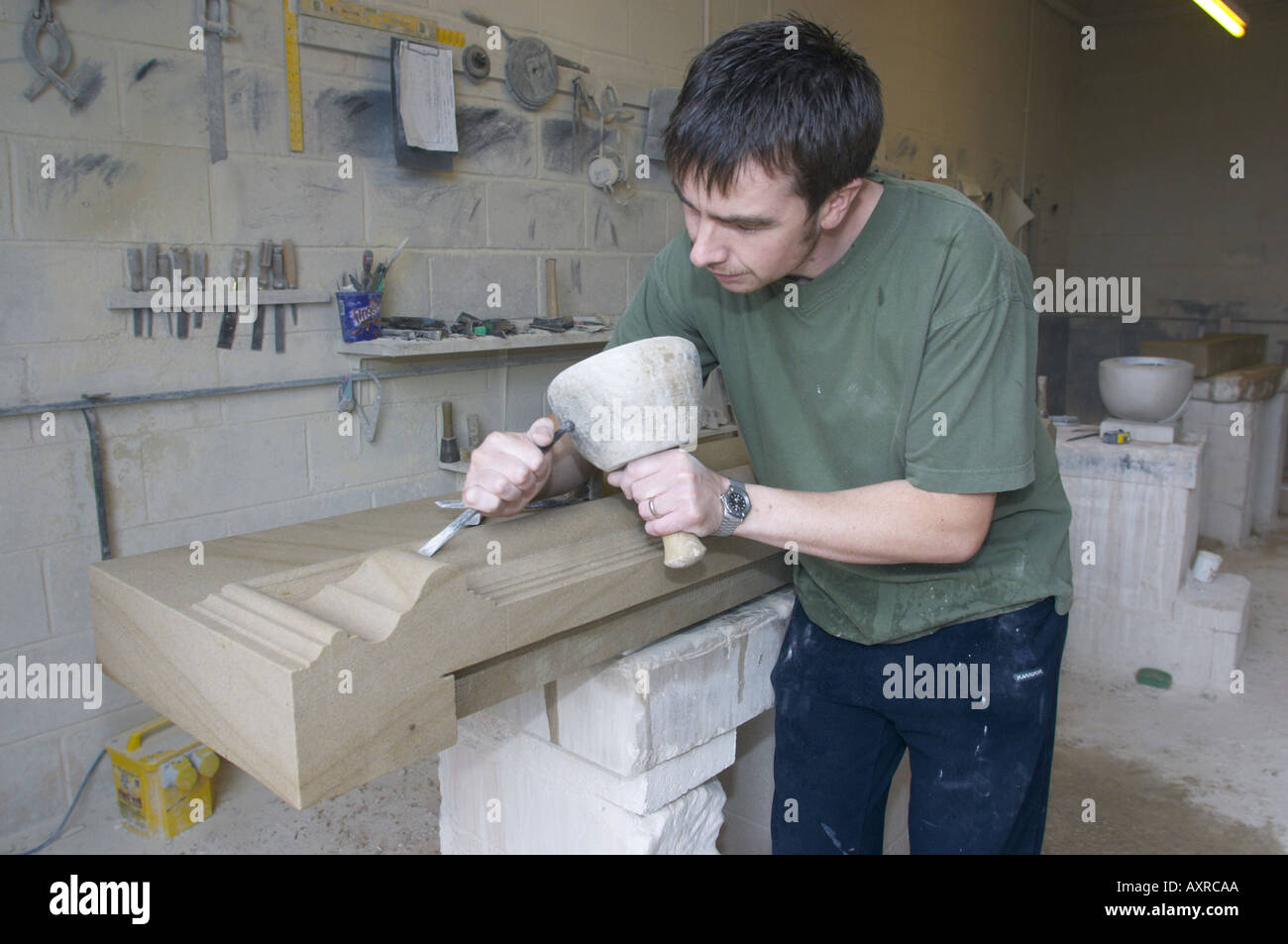 craftsman sculpting a stone fireplace Stock Photo - Alamy