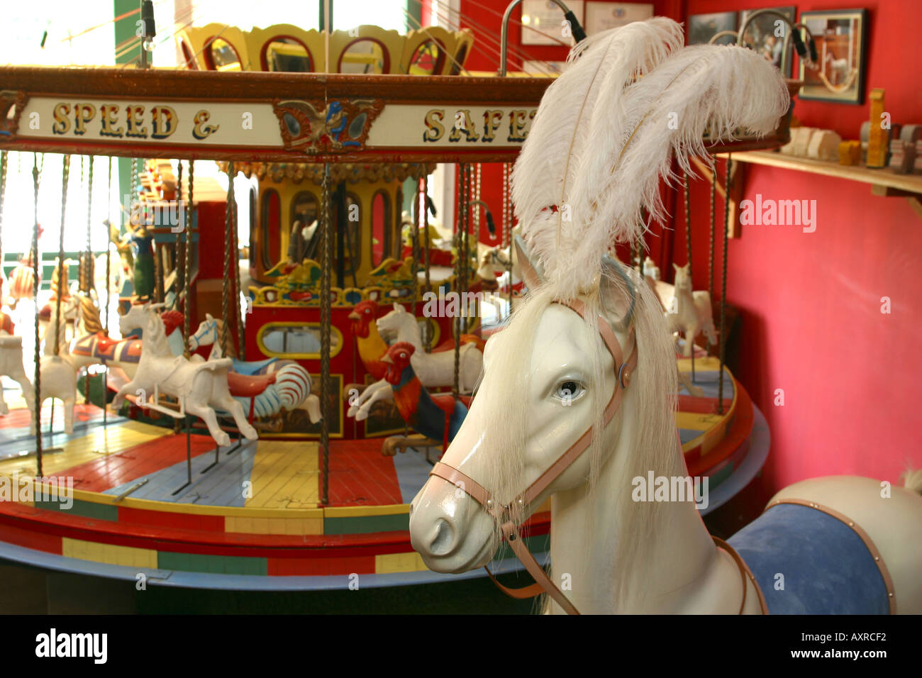 hand made rocking horse and merry go round in shop Stock Photo - Alamy