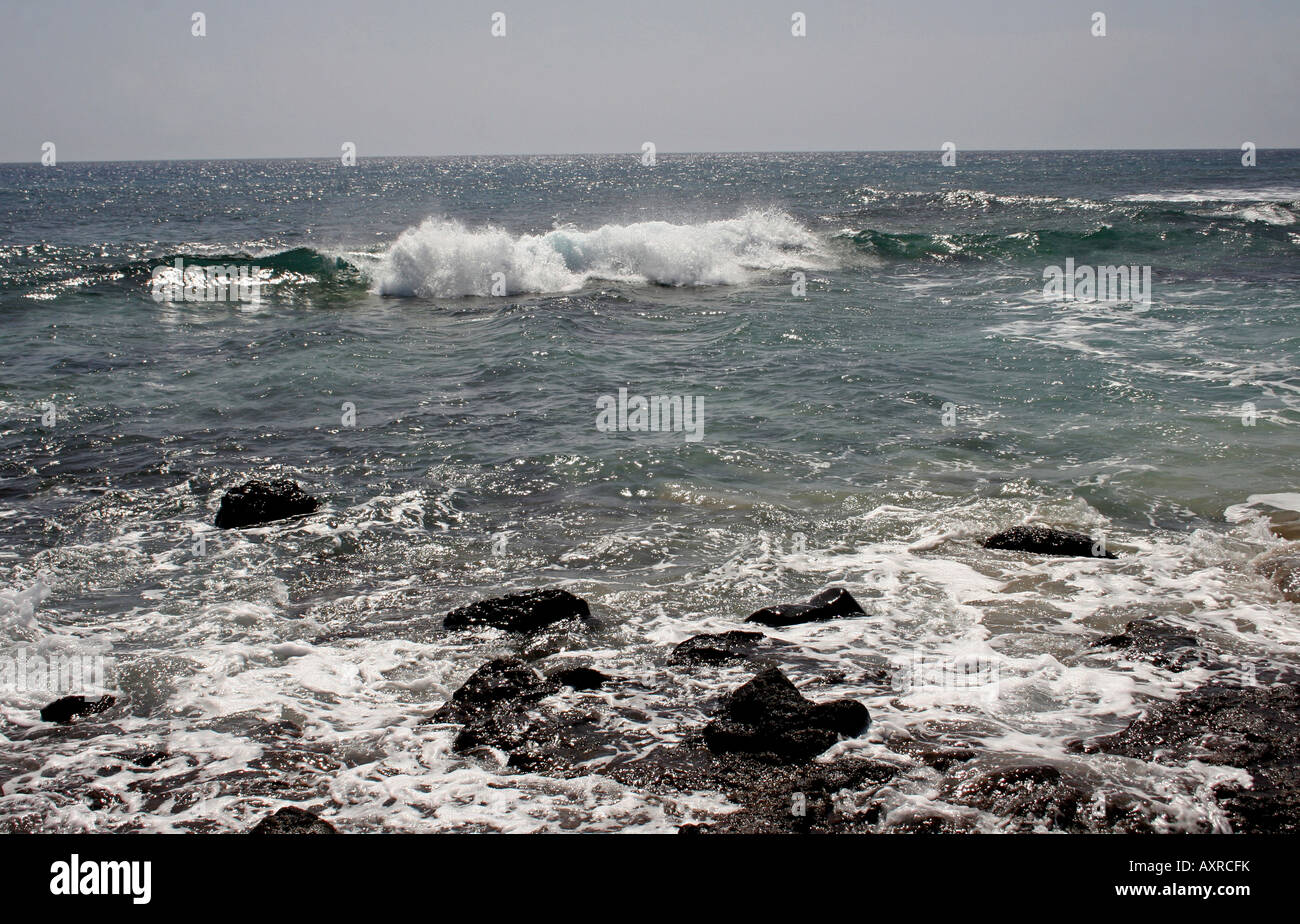 Breaking wave waves rocky shore surf hi-res stock photography and ...
