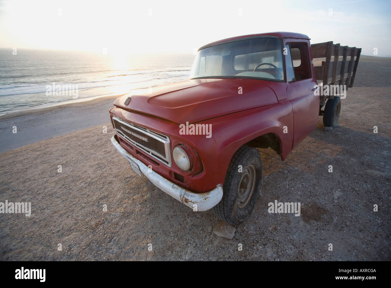 Red farm truck on beach Stock Photo - Alamy