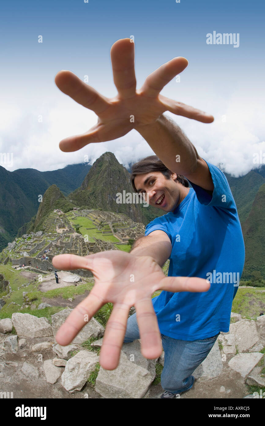 A man at the ancient Inca ruins of Machu Picchu Peru Stock Photo - Alamy