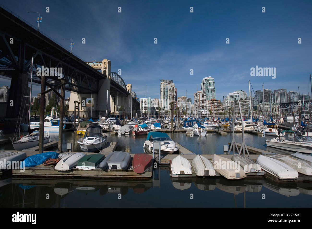 Harbour with cityscape in background Stock Photo - Alamy