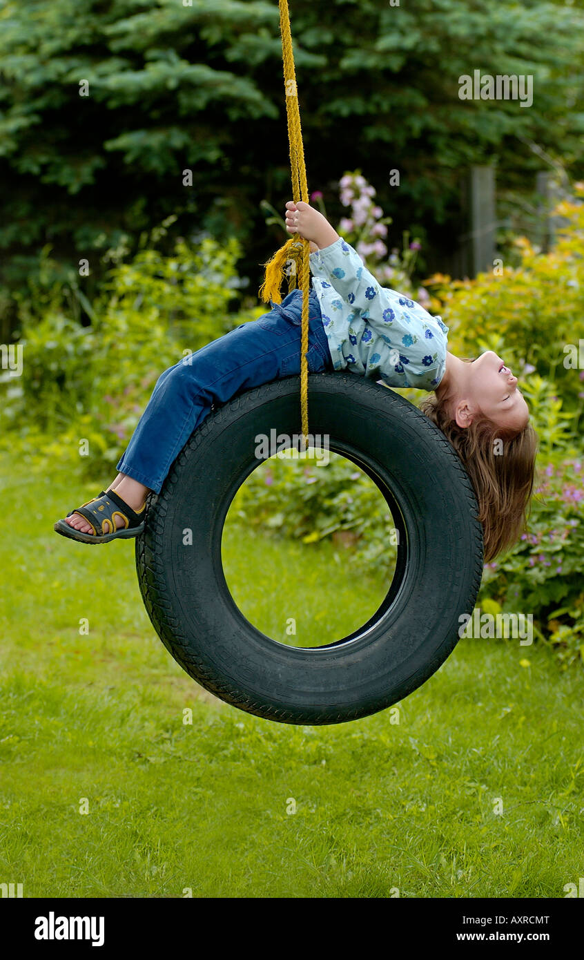 girl on a tire swing Stock Photo - Alamy