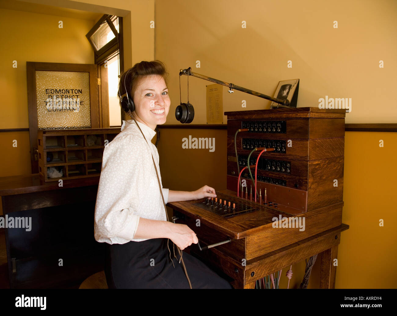 Woman working at telephone switchboard Stock Photo - Alamy