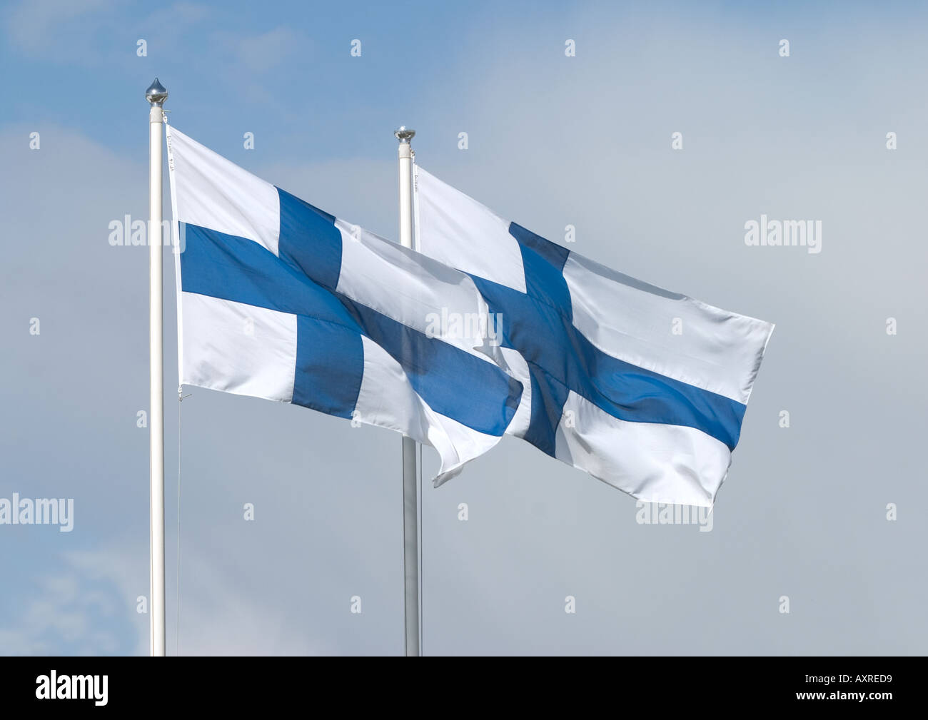 Blowing side by side in the wind against blue sky hi-res stock ...