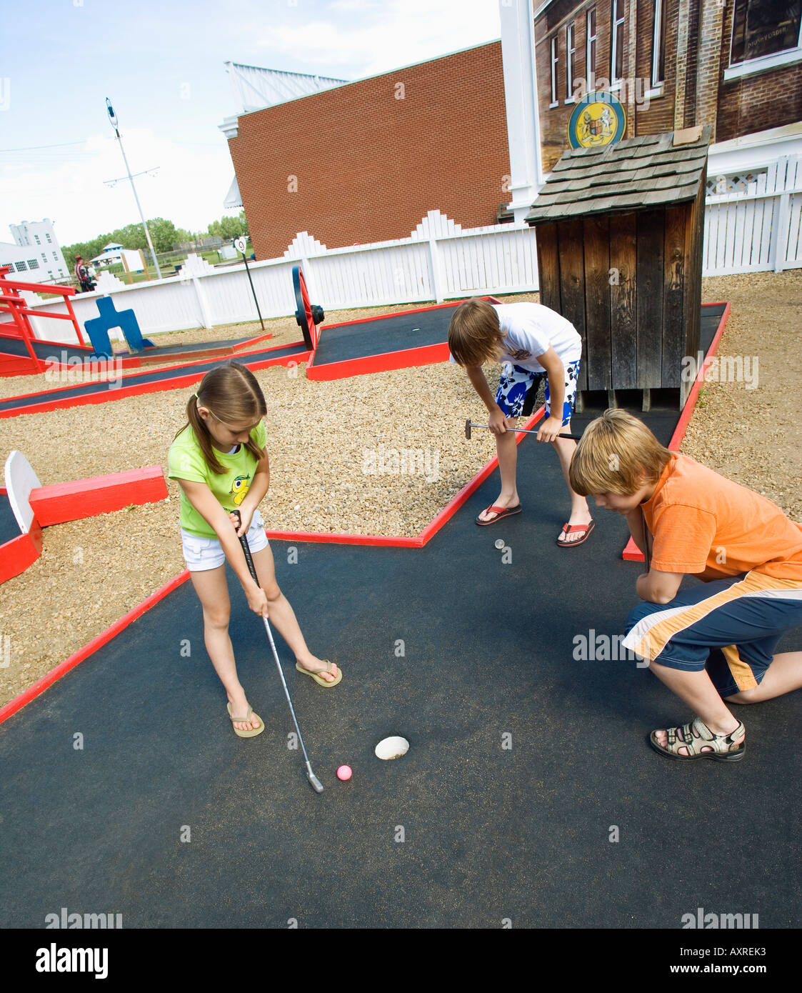 Children playing mini golf Stock Photo - Alamy