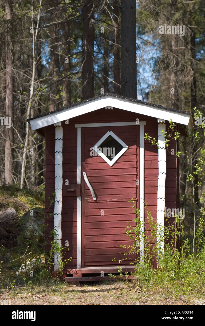 Old-fashioned, red wooden outhouse in the forest , Finland Stock Photo ...