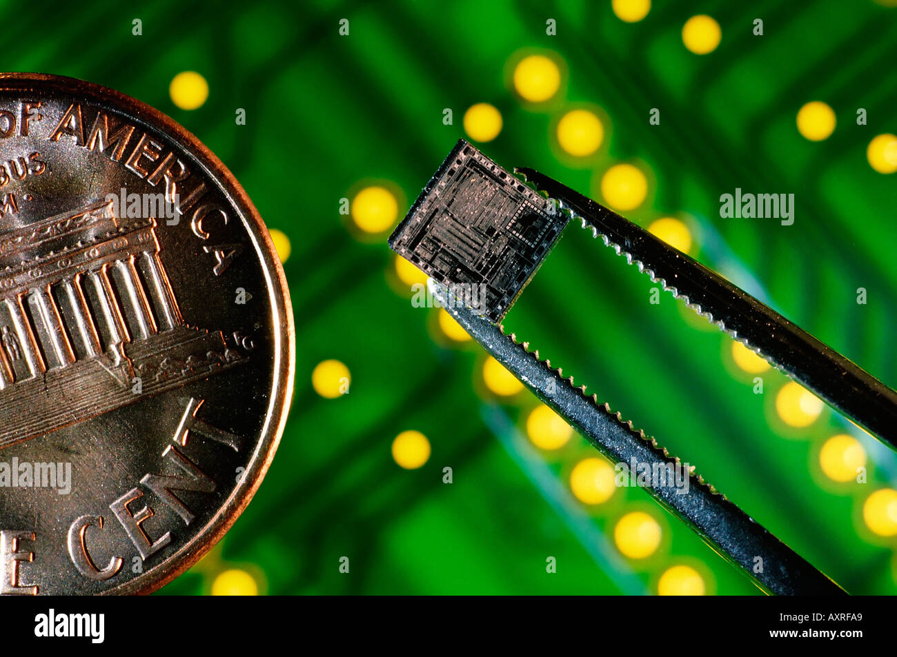 Silicon IC Chip Sized Next to Penny Stock Photo - Alamy