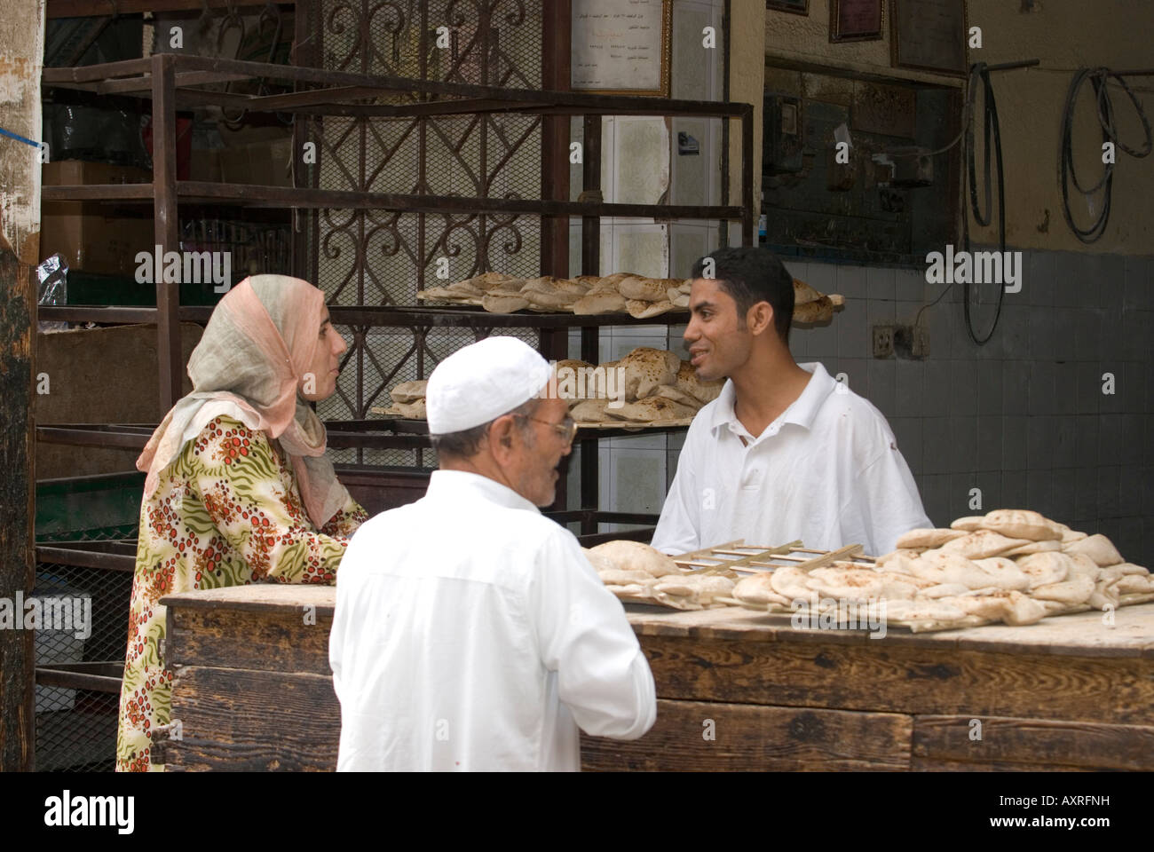 Egyptian man selling bread at street side bakery in Ismailia Egypt ...