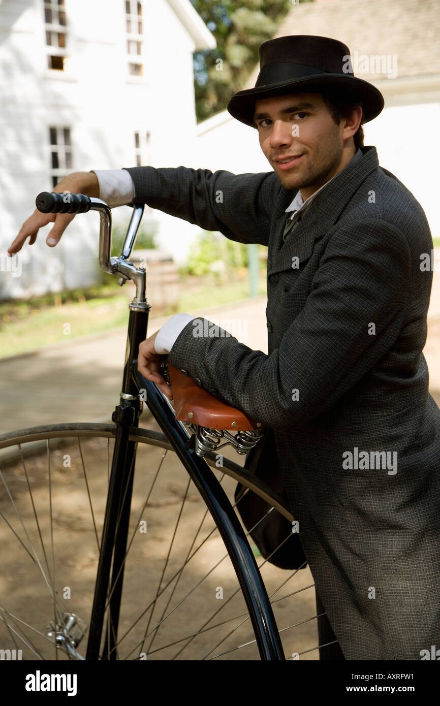 Man in period costume with an antique unicycle Stock Photo - Alamy