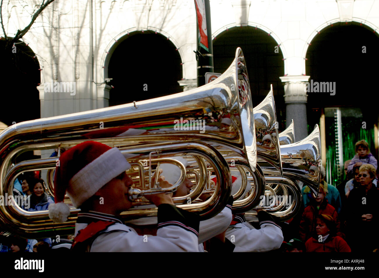 A band playing and marching in the Santa Claus parade Stock Photo - Alamy