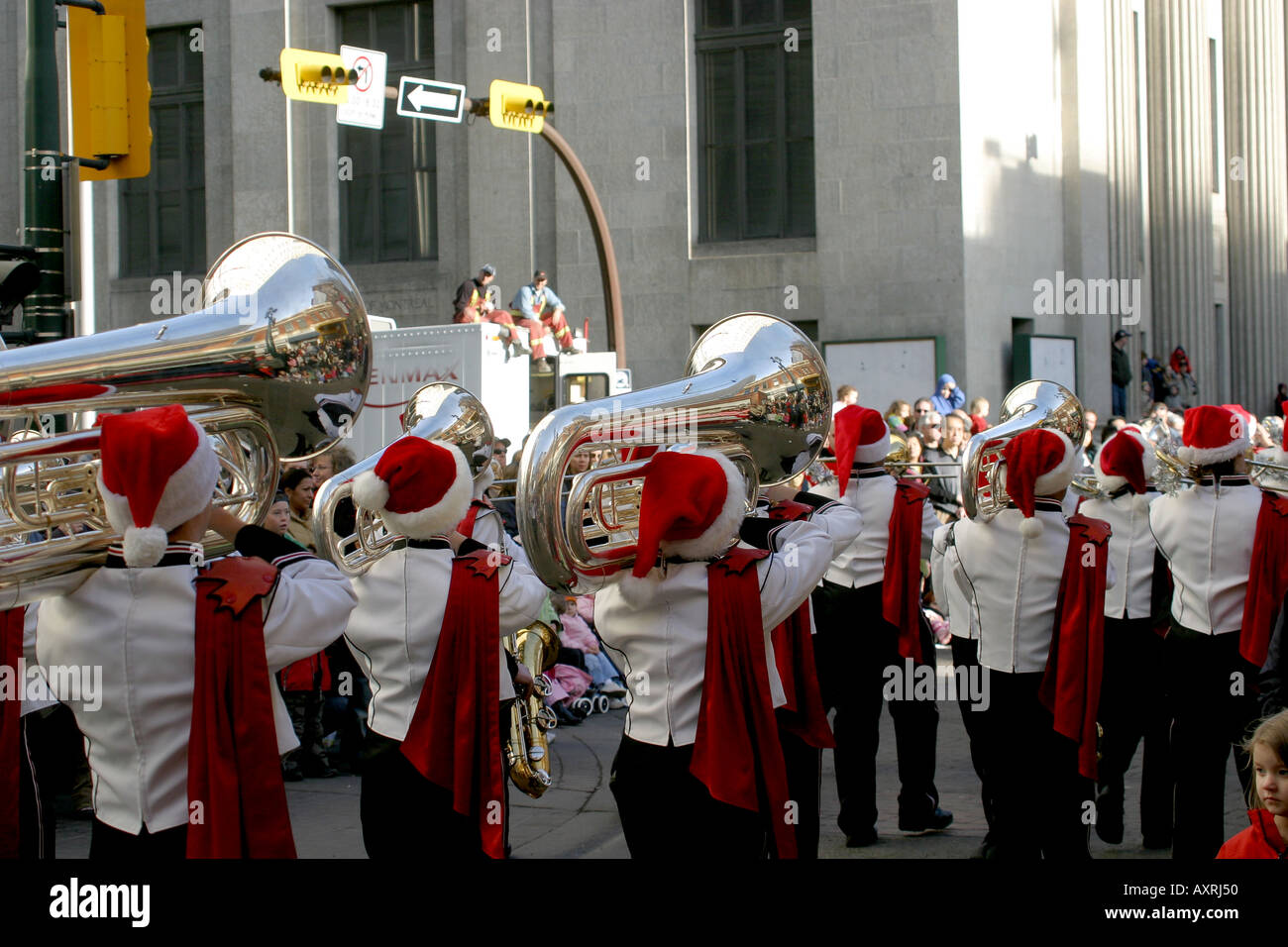 A band playing and marching in the Santa Claus parade Stock Photo - Alamy