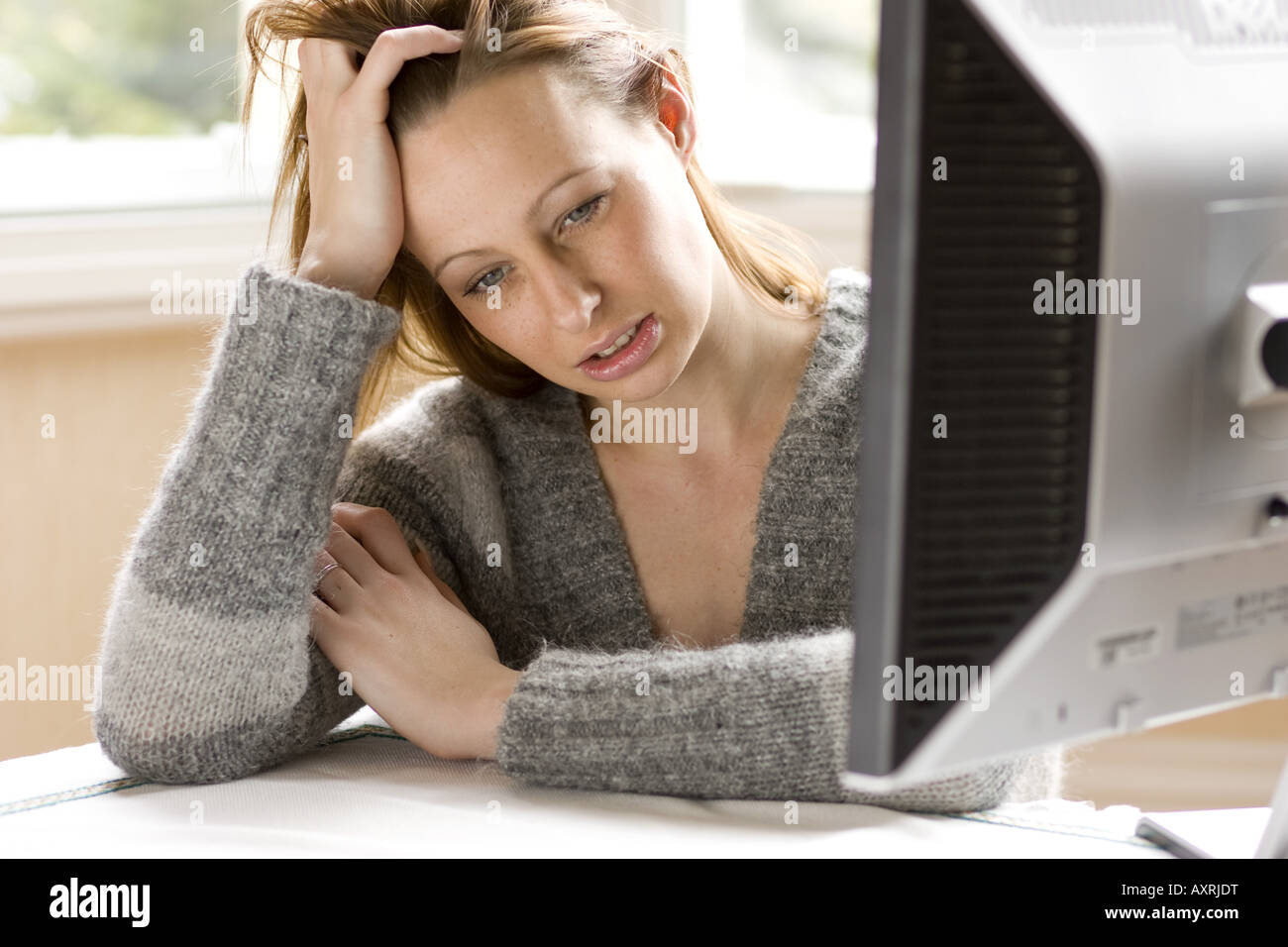 Frustrated woman using computer Stock Photo - Alamy