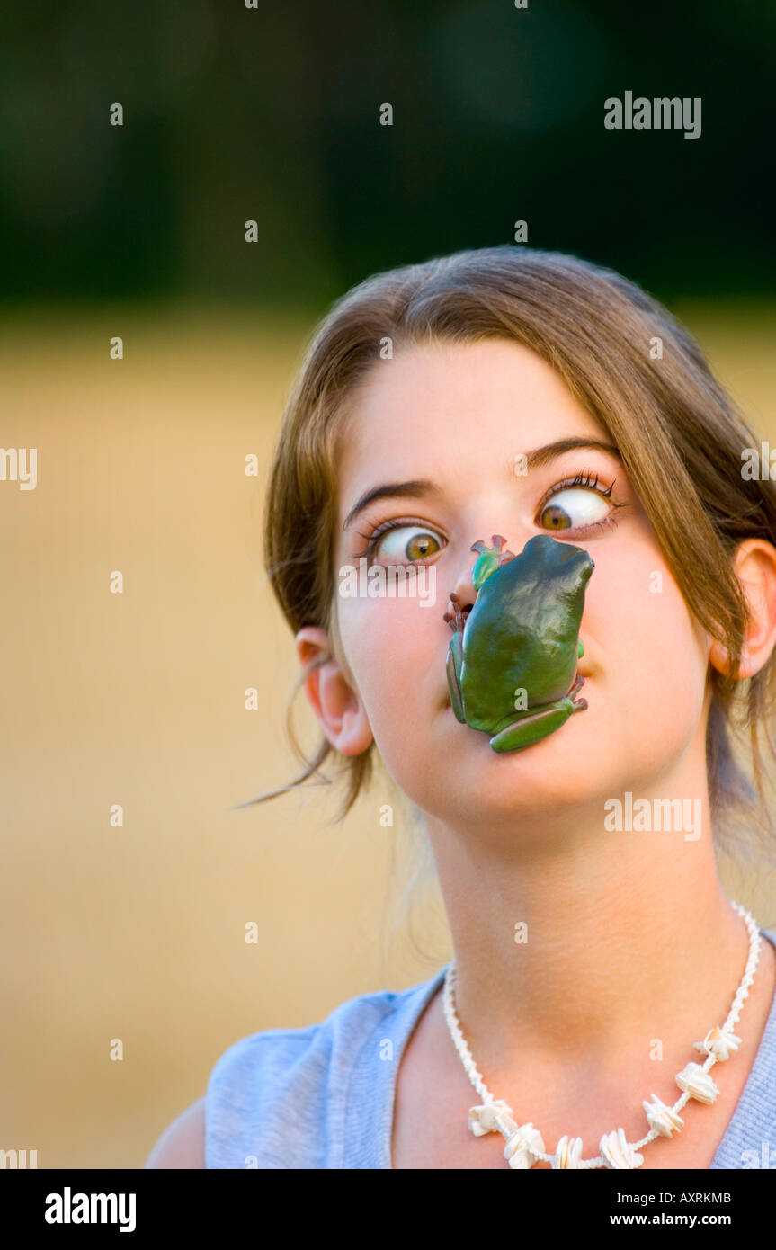 Girl with frog on her face Stock Photo - Alamy