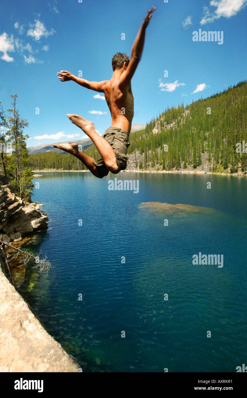 High jump into lake Stock Photo - Alamy