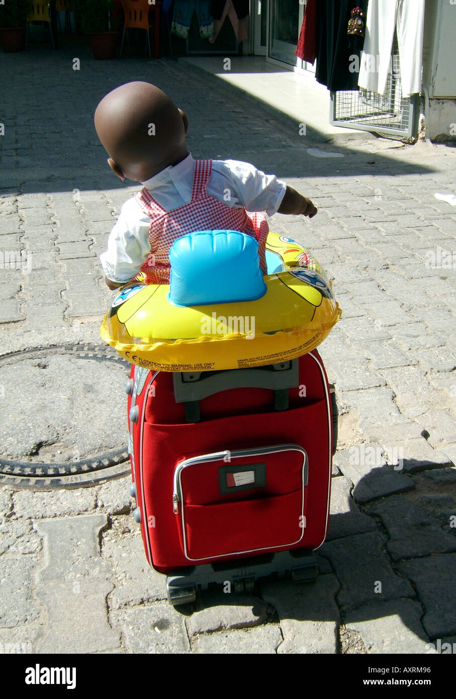 black doll in toy car Stock Photo - Alamy