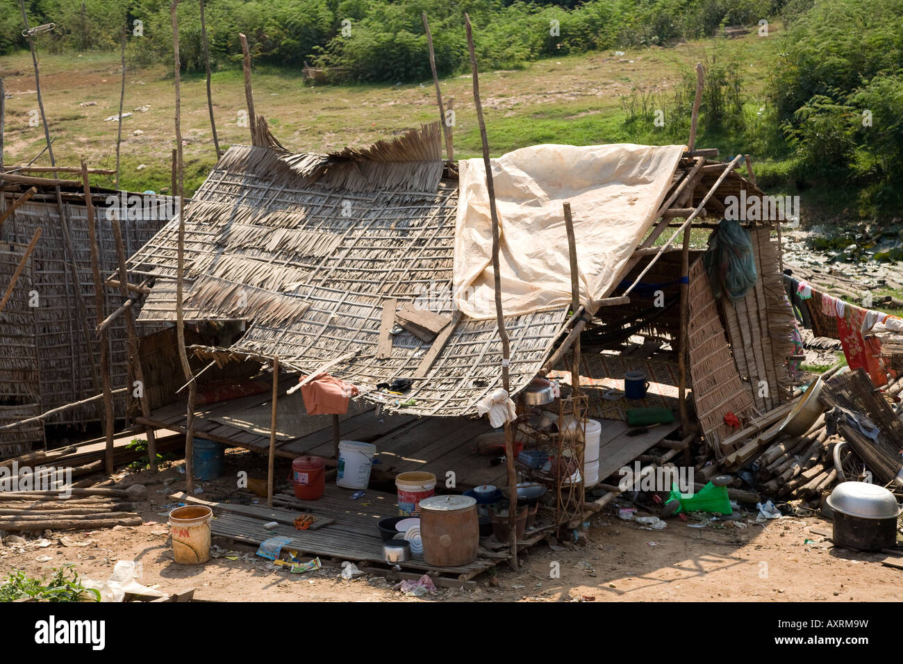 A shack in rural Cambodia (Siem Reap) struggles to remain standing ...