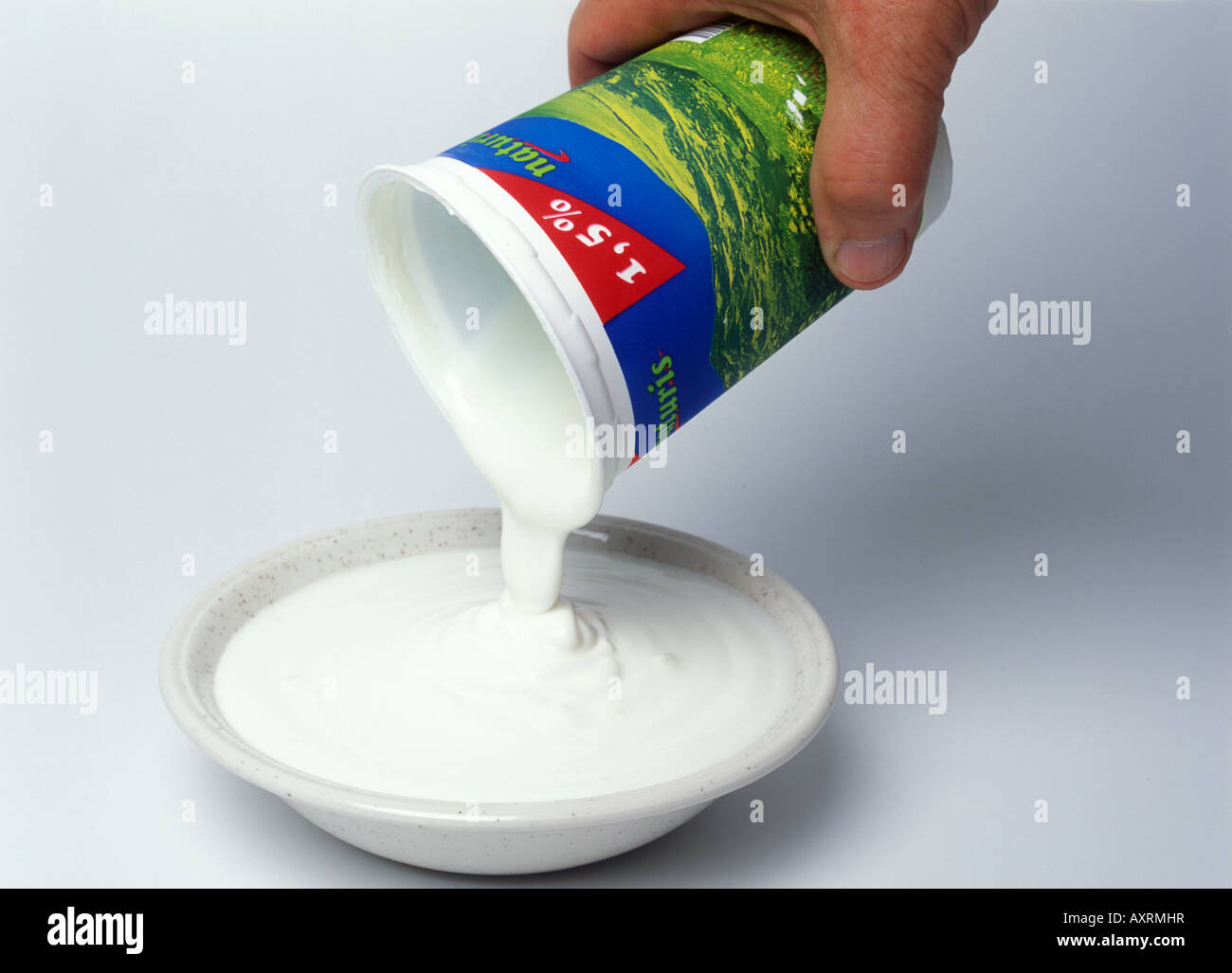 Yoghurt being poured into a dish Stock Photo - Alamy