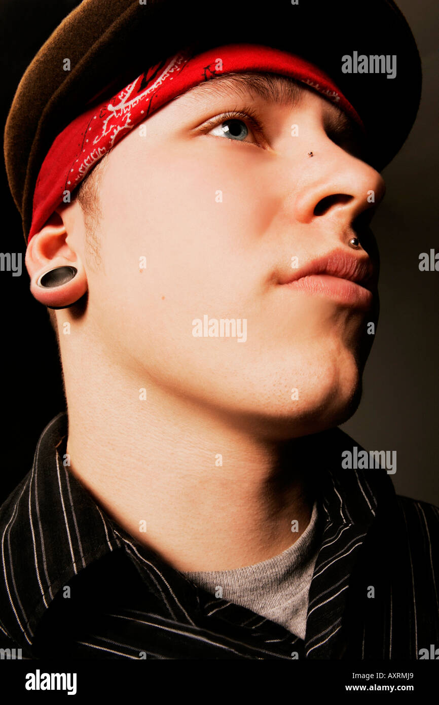 Portrait of young man with piercings Stock Photo - Alamy