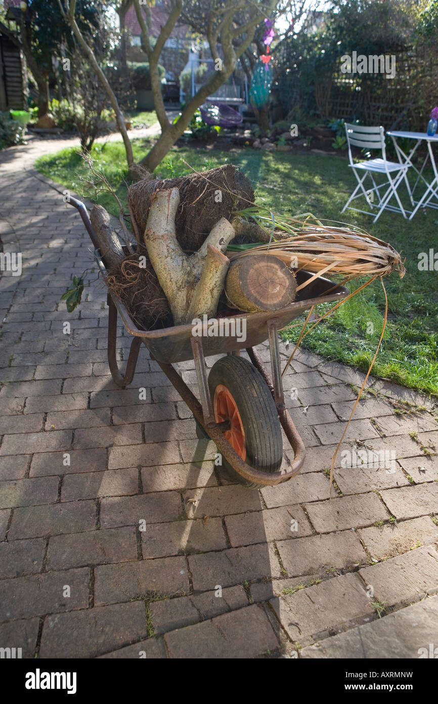 Wheelbarrow filled with garden waste hi-res stock photography and ...