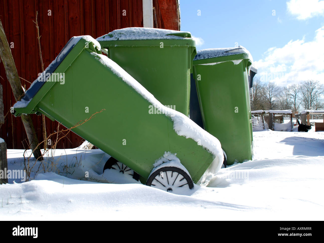 three garbage bin in snow Stock Photo - Alamy
